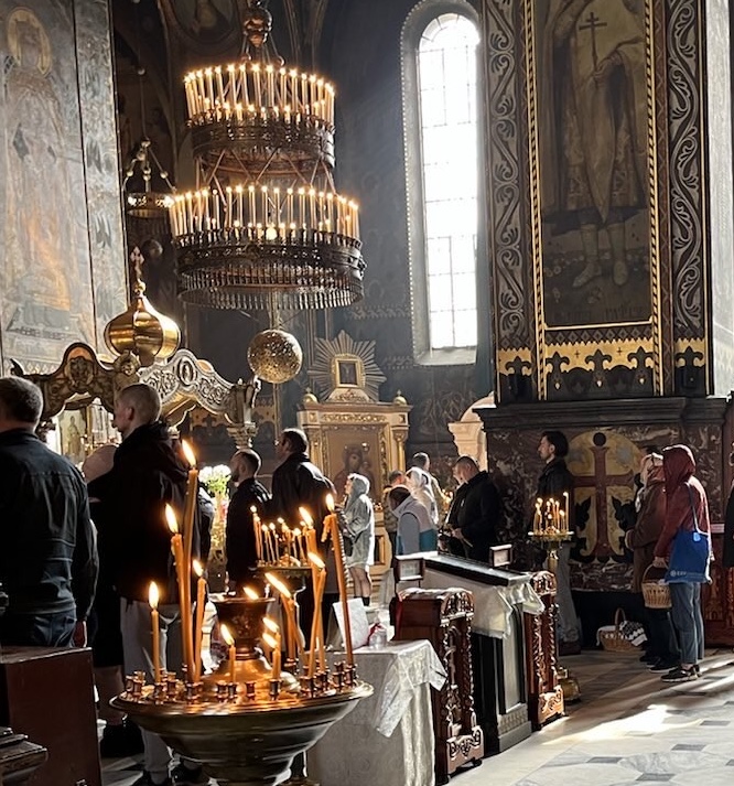Easter Services in Kyiv: A Soldier Lights a Candle – Soldier of Fortune ...